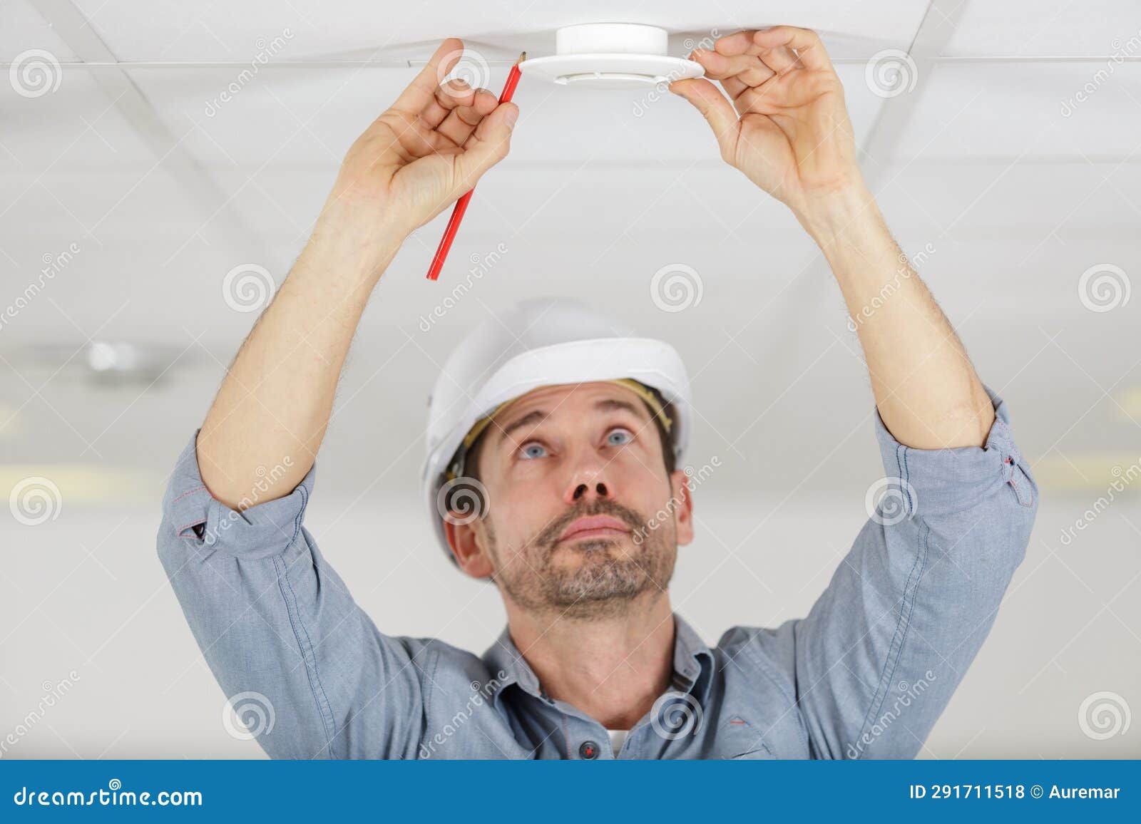 Builder Marking Spot with Pencil Stock Photo - Image of finishing ...