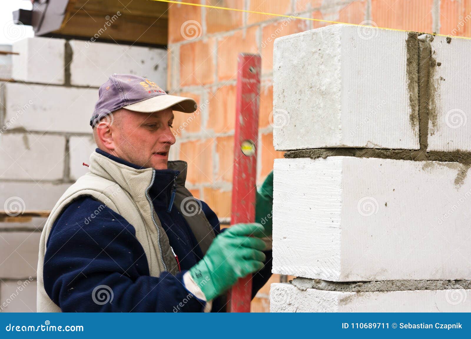 Builder or mason at work stock image. Image of hard - 110689711