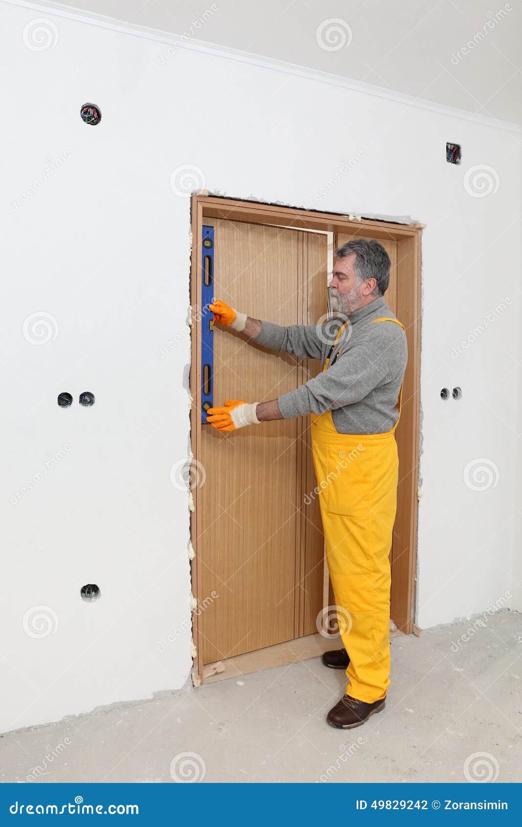 Builder Measure Verticality of Door with Level Tool Stock Photo - Image ...