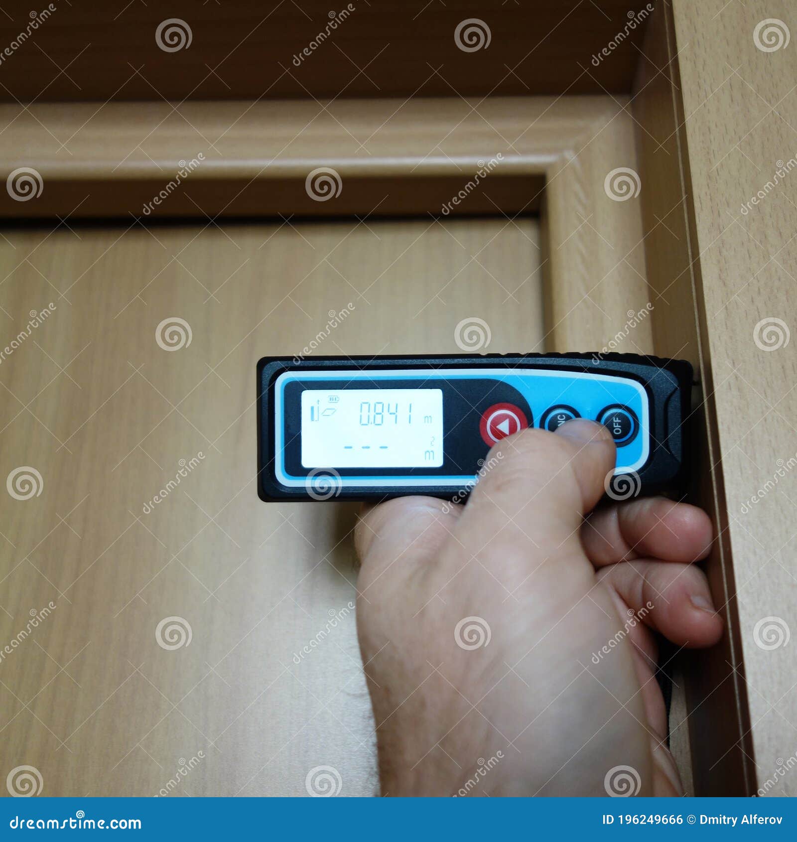 The Builder Measures the Door Opening with a Laser Ruler. Construction ...