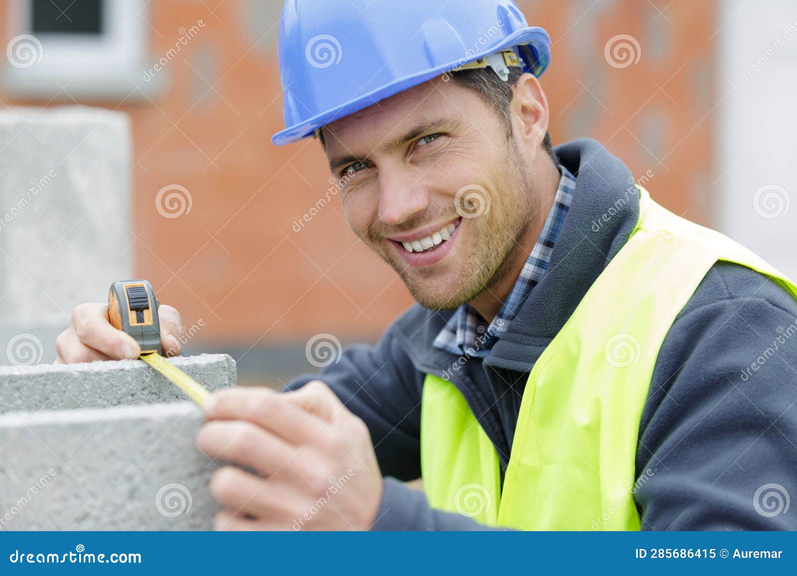 Builder Measuring Cement Block Stock Image - Image of measure, builder ...