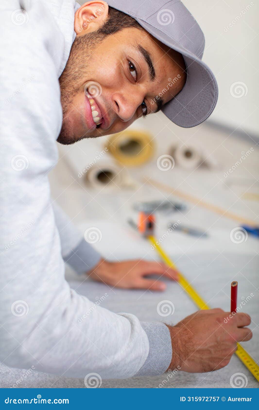 Builder Measuring Floor Using Tape Measure and Pencil Stock Image ...
