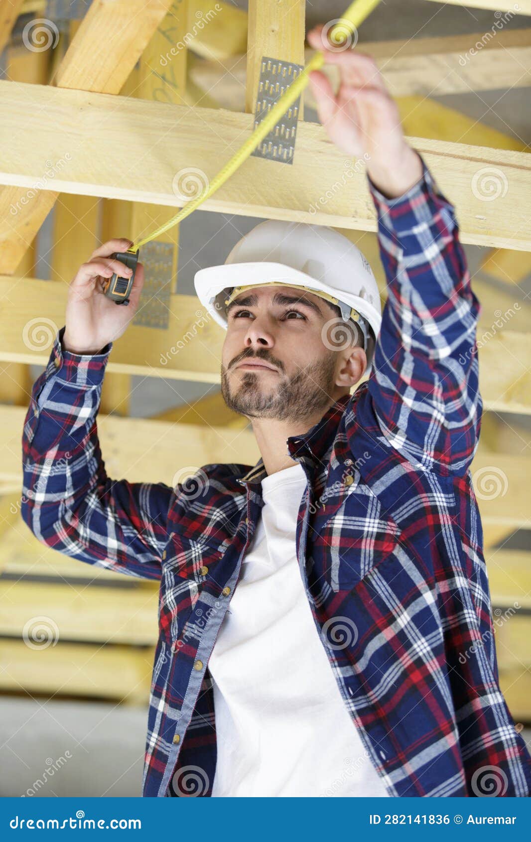 Builder Measuring Roof Truss Stock Photo - Image of measureheight ...