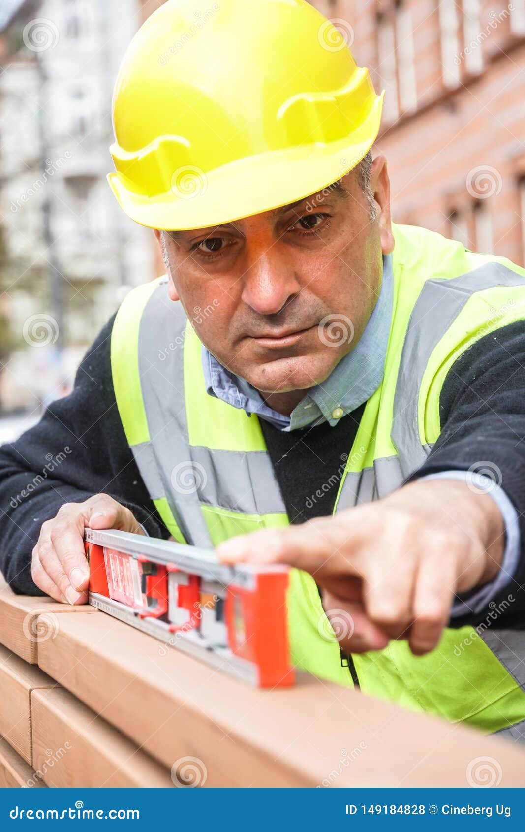 Builder Measuring with a Tubular Spirit Level Stock Photo - Image of ...