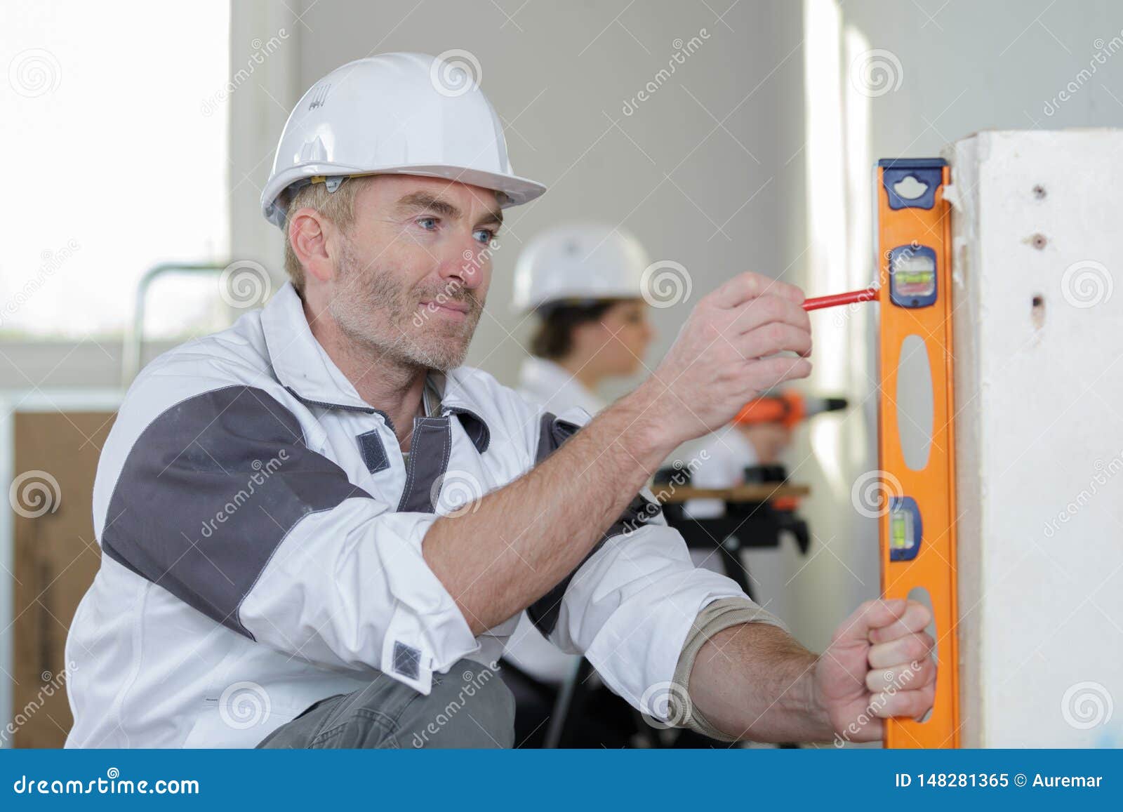 Builder Measuring Wall with Level Stock Image - Image of renovation ...