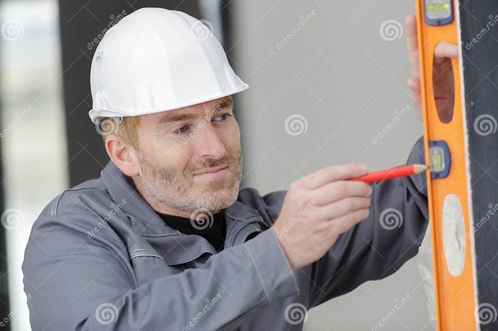 Builder Measuring Wall Vertically Stock Photo - Image of bubble ...