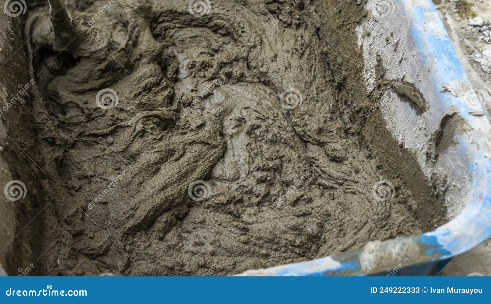 The Builder Mixes the Construction Mixture in a Container for Guiding ...