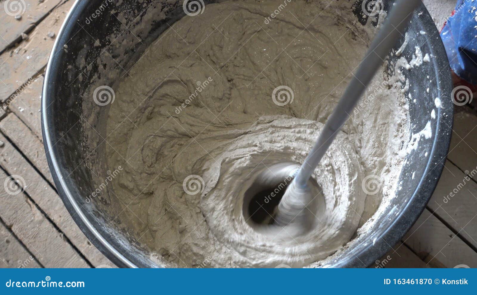 Builder Mixes Dry Construction Mixture, Plaster, Stuffing with Manual ...