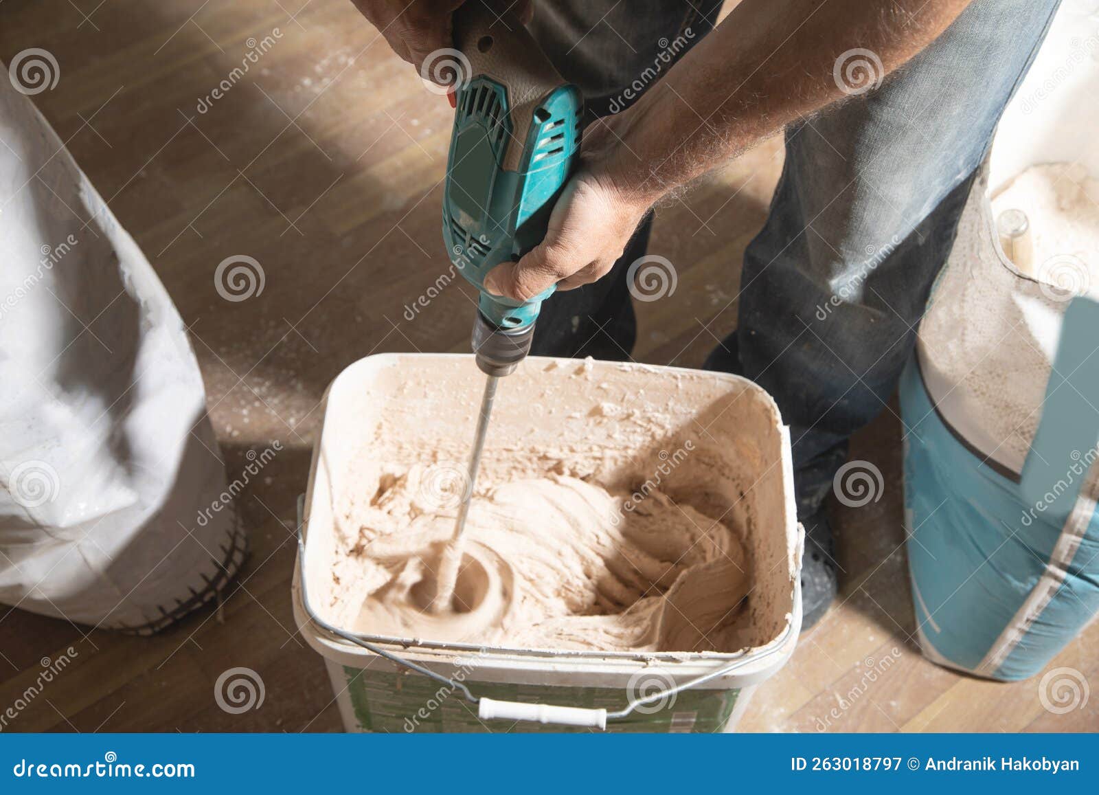 Builder Mixes Gypsum Putty in a Bucket Stock Image - Image of material ...