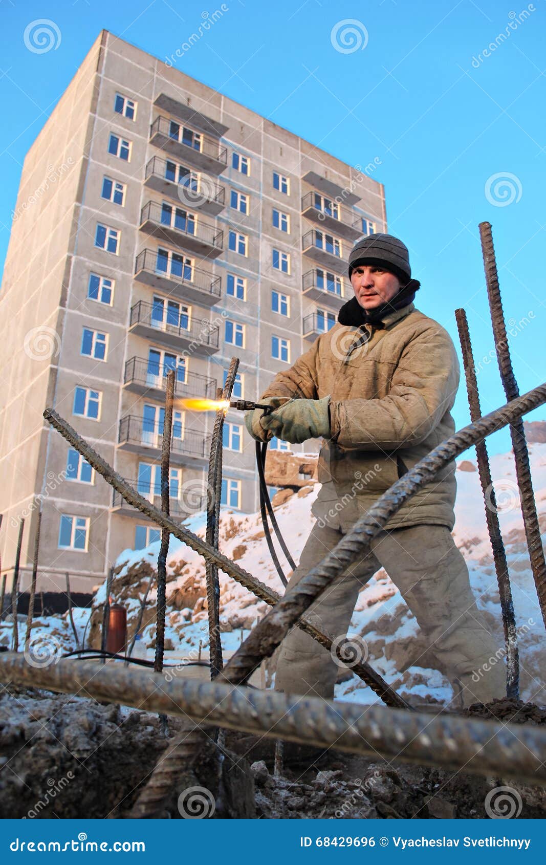 Builder Performs Welding Work at the Construction Site Stock Photo ...