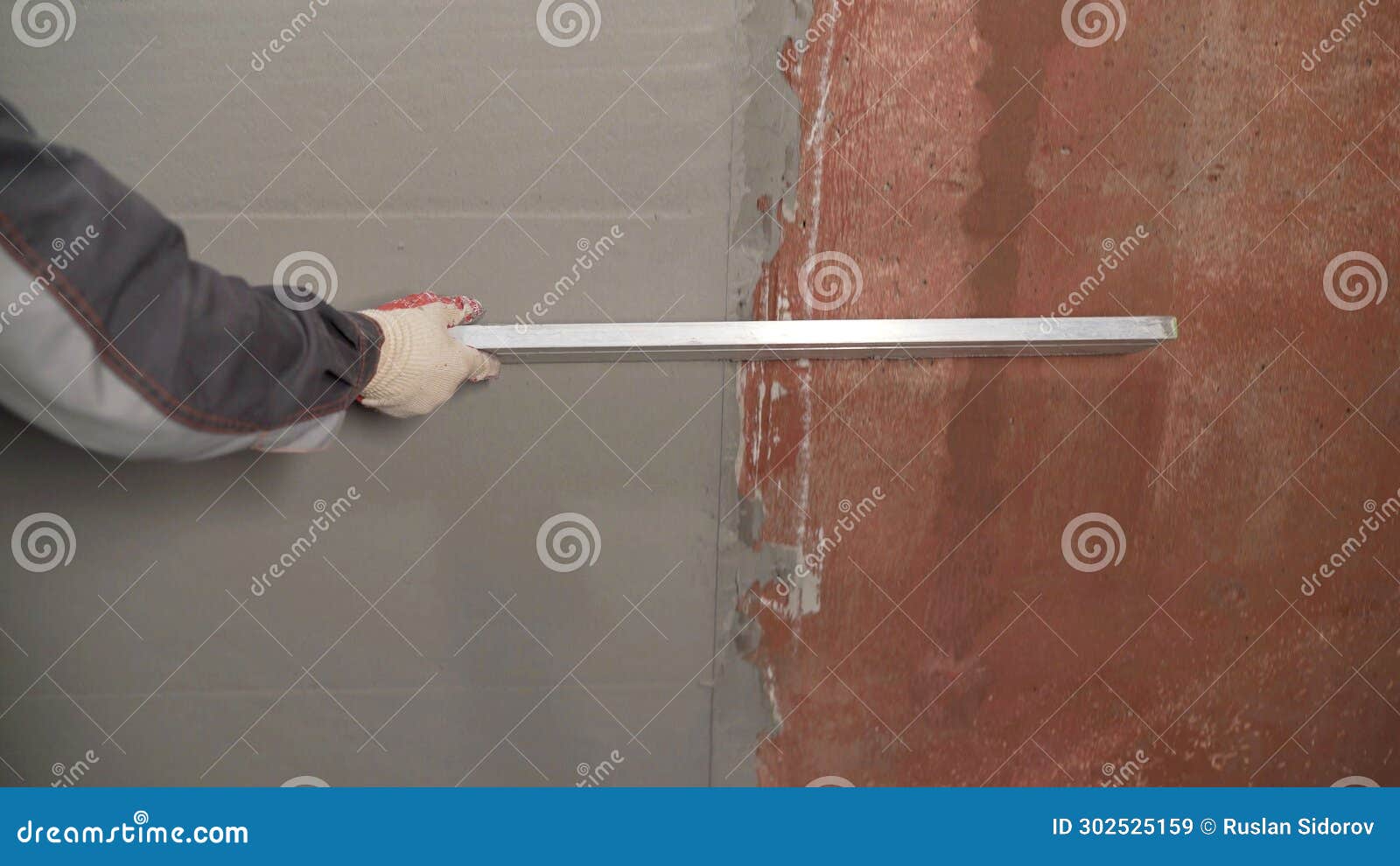 A Builder Plasters a Wall in an Apartment with Cement Concrete. a Human ...