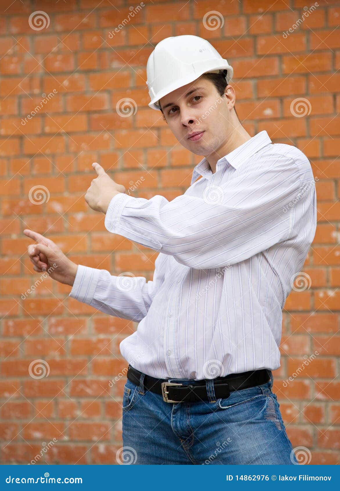 Builder Pointing To Brick Wall Stock Photo - Image of occupation ...