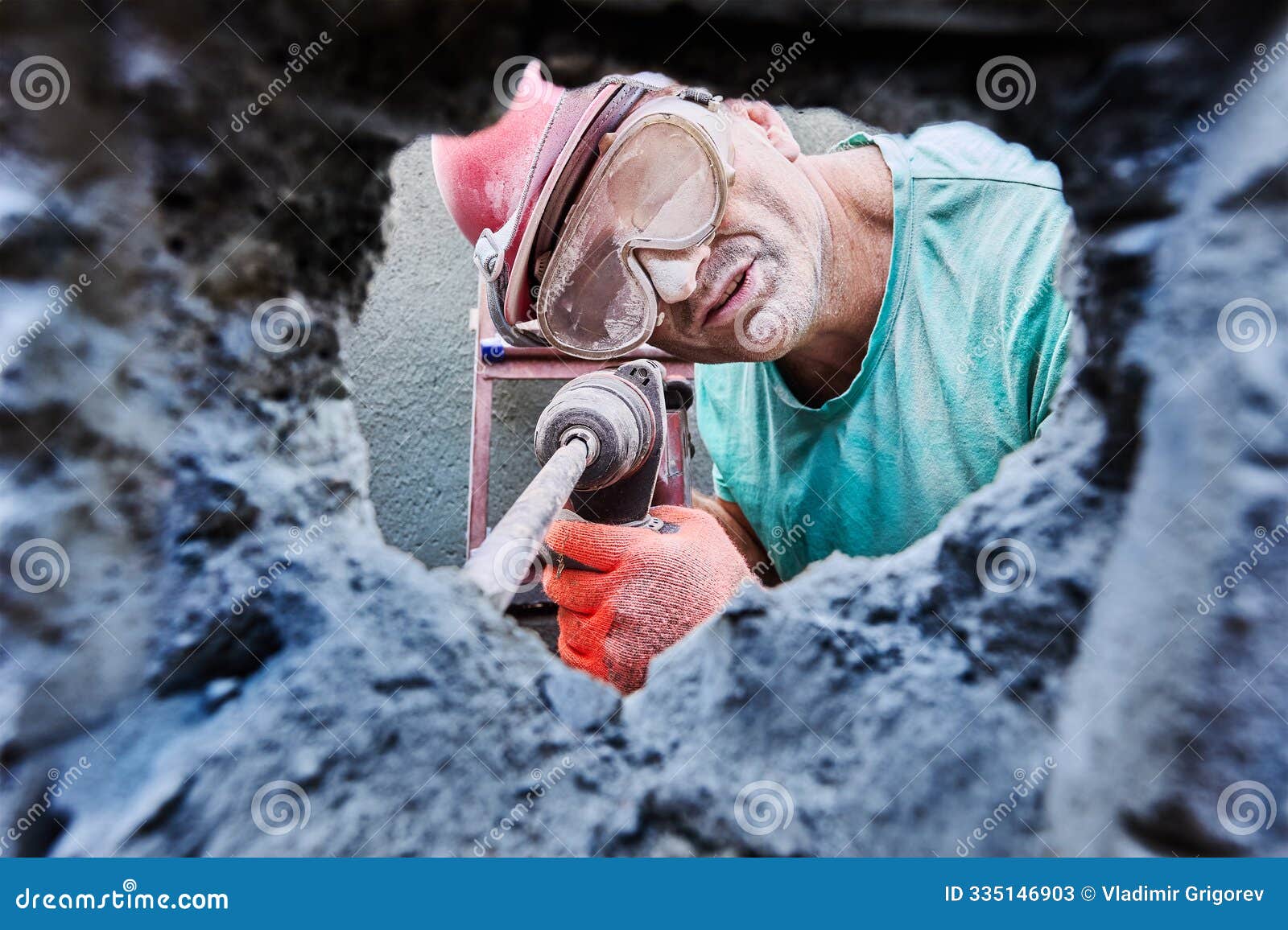 Builder Pounding Chiseling into Tough Concrete with Rotary Hammer ...