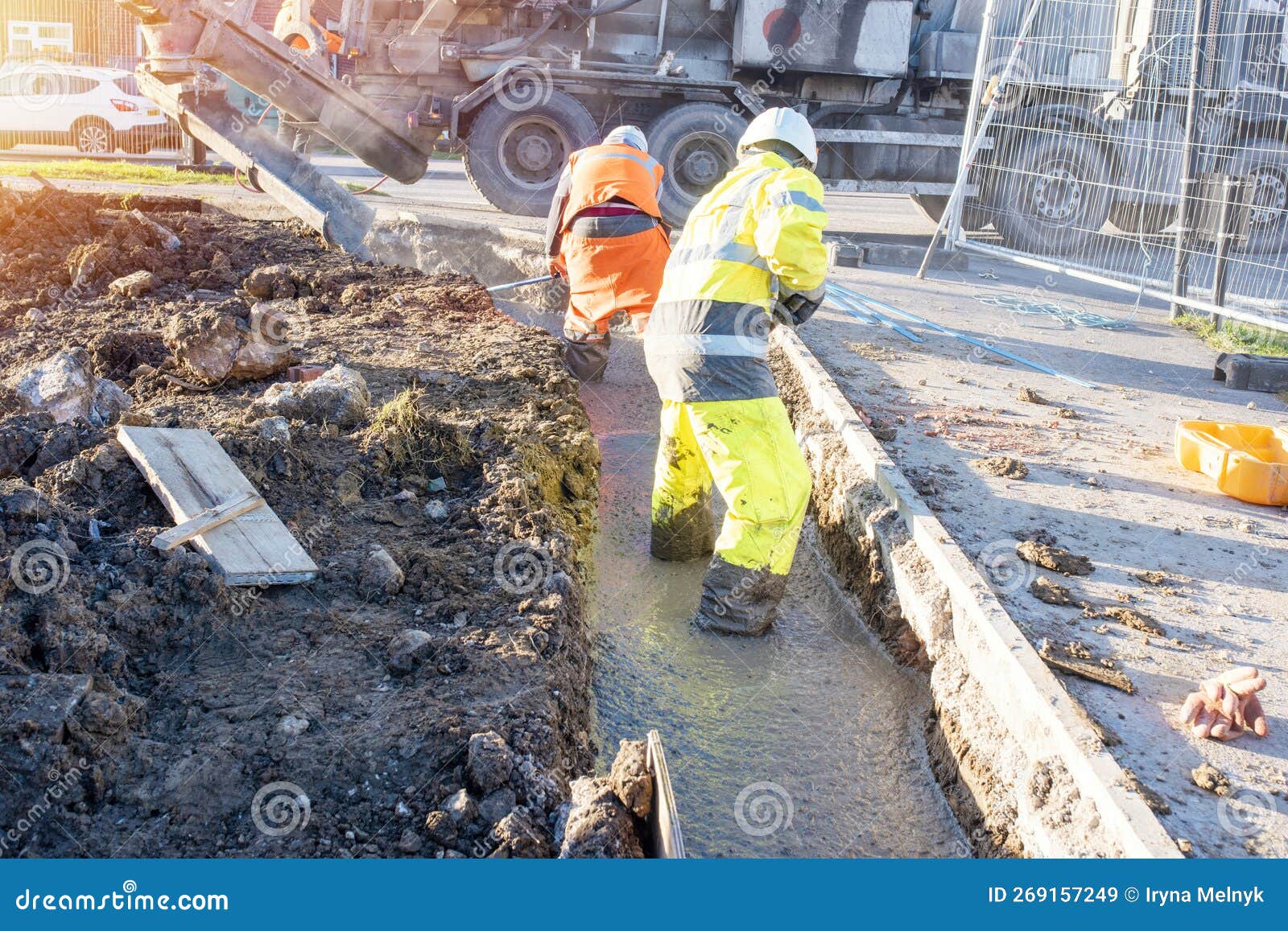Builder Pouring Wall Foundation with Wet Ready-mix Concrete, Levelling ...