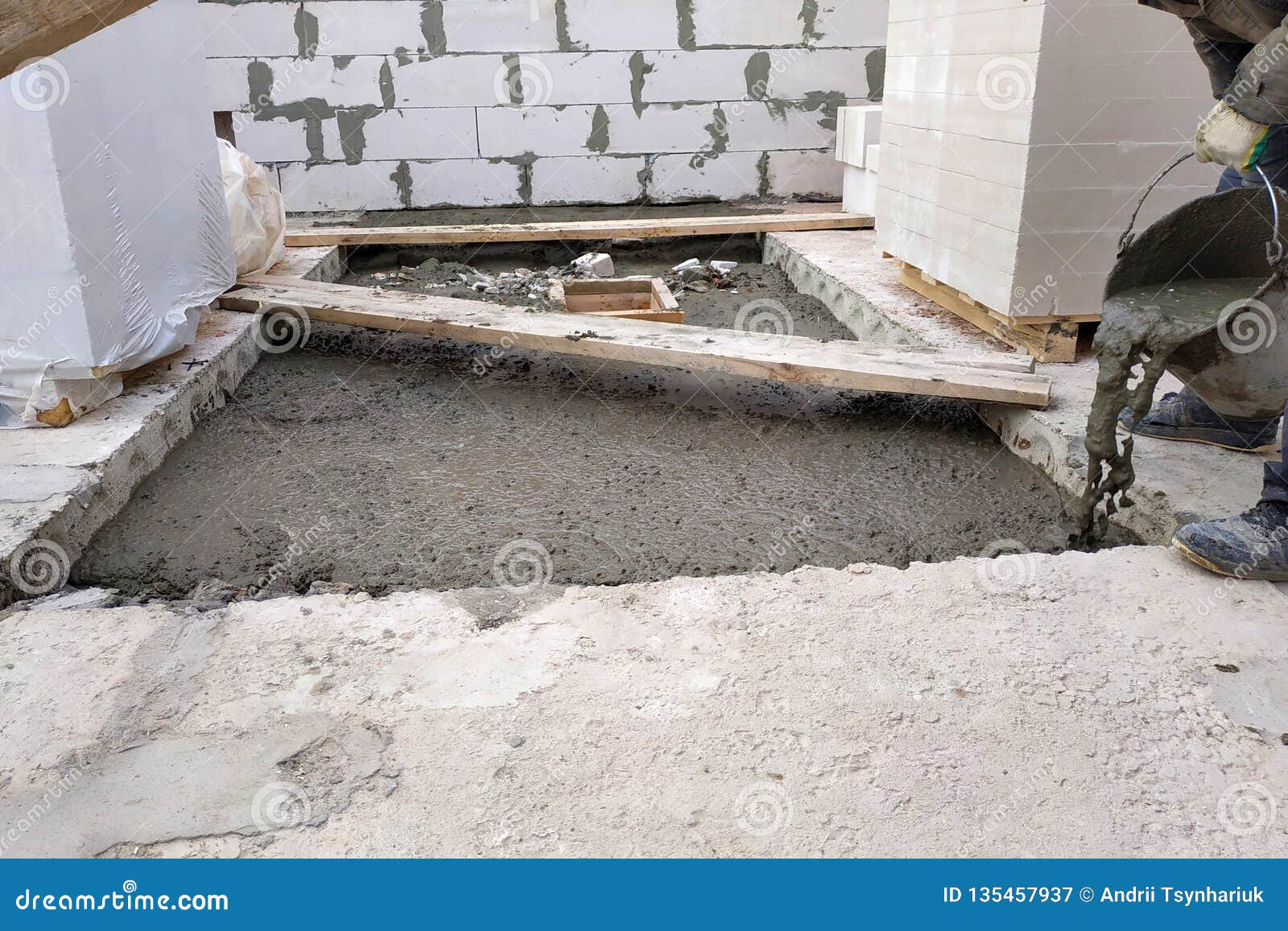 The Builder Pours a Cement Mortar Slab between the Floors of the House ...