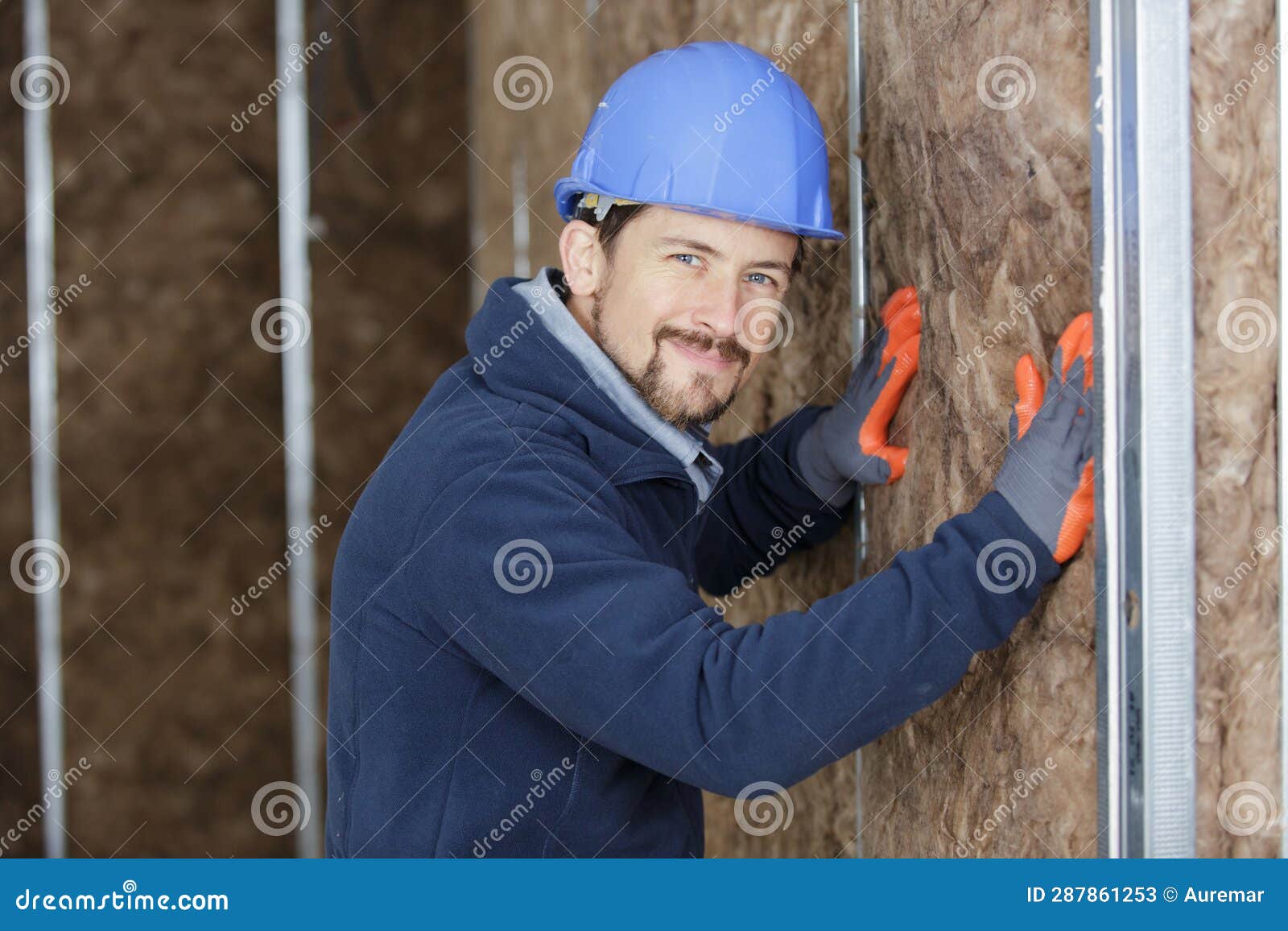 Builder in Protective Helmet and Gloves Doing Insulation Works Stock ...