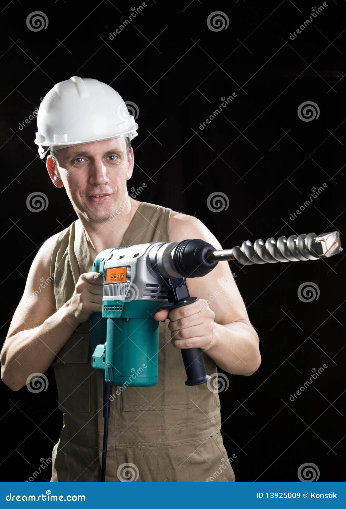 The Builder in a Protective Helmet Holds the Profe Stock Image - Image ...