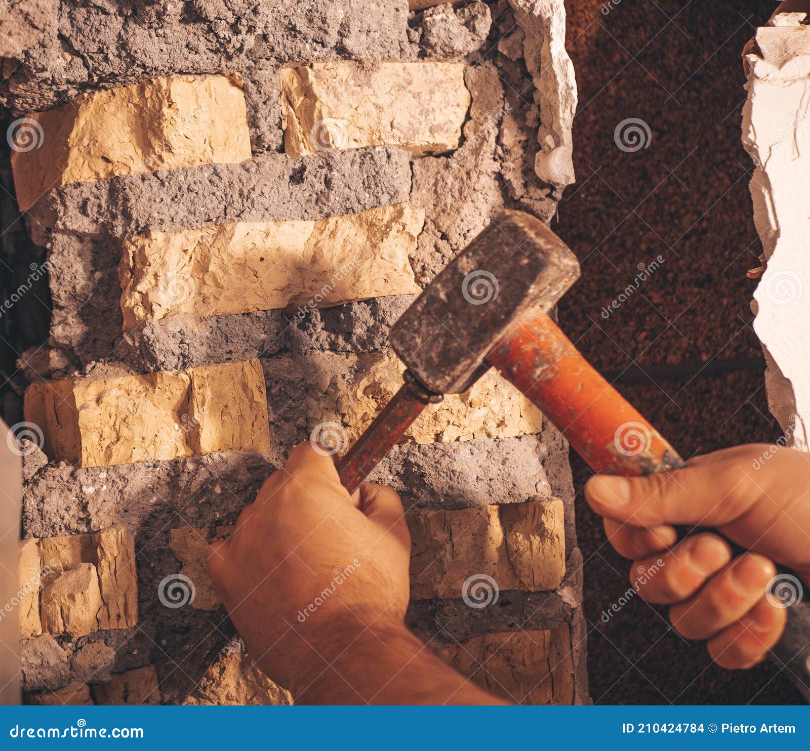 Builder Punches a Hole in the Wall with a Hammer, Close Up Stock Photo ...