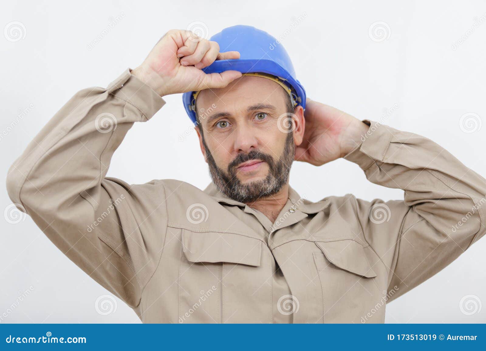 Builder putting hard hat stock image. Image of length - 173513019
