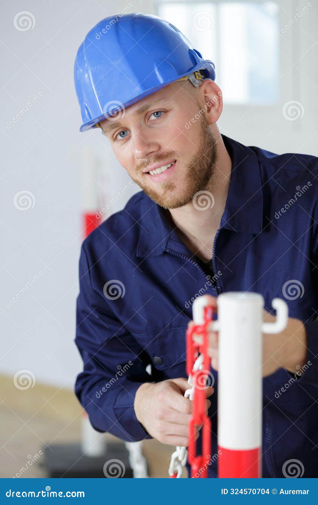 Builder Putting Up Safety Chain Around Work Area Stock Photo - Image of ...