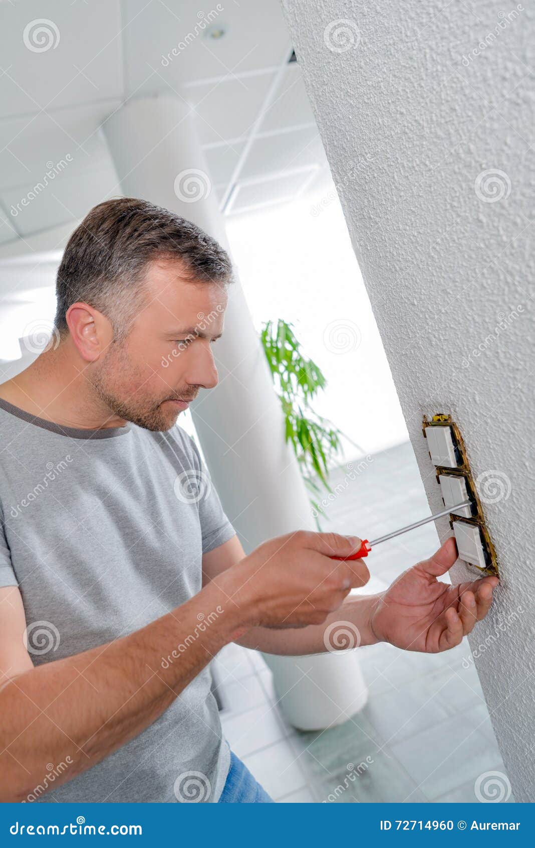Builder Repairing Light Switch Stock Photo - Image of tradesman, build ...