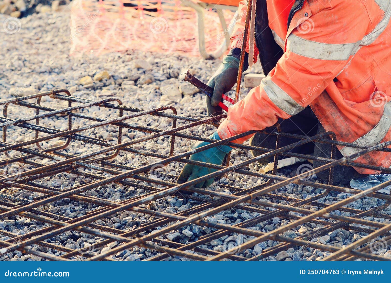 Builders Hands Fixing Steel Reinforcement Bars at Construction Site ...