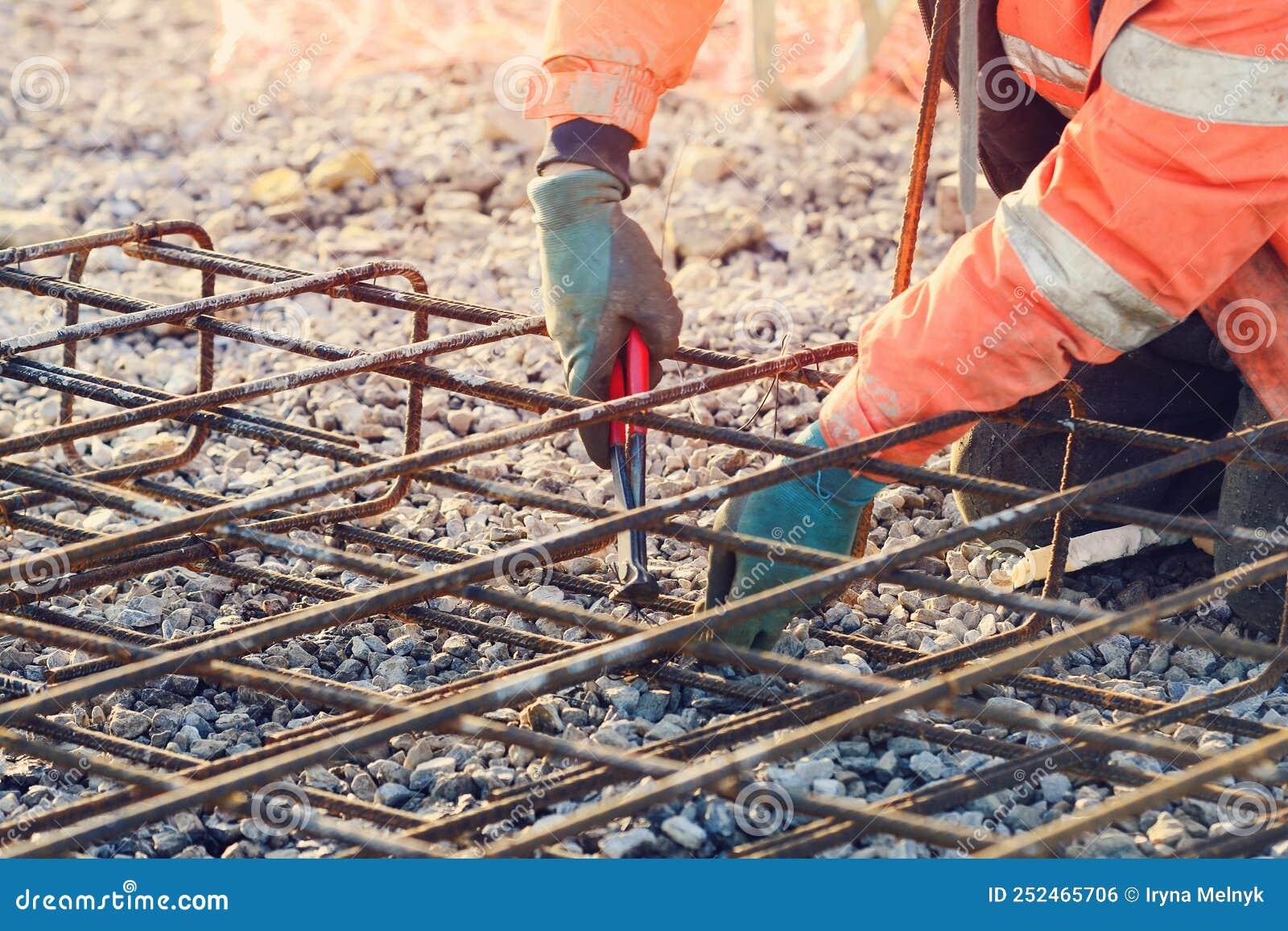 Builder`s Hands Fixing Steel Reinforcement Bars at Construction Site ...