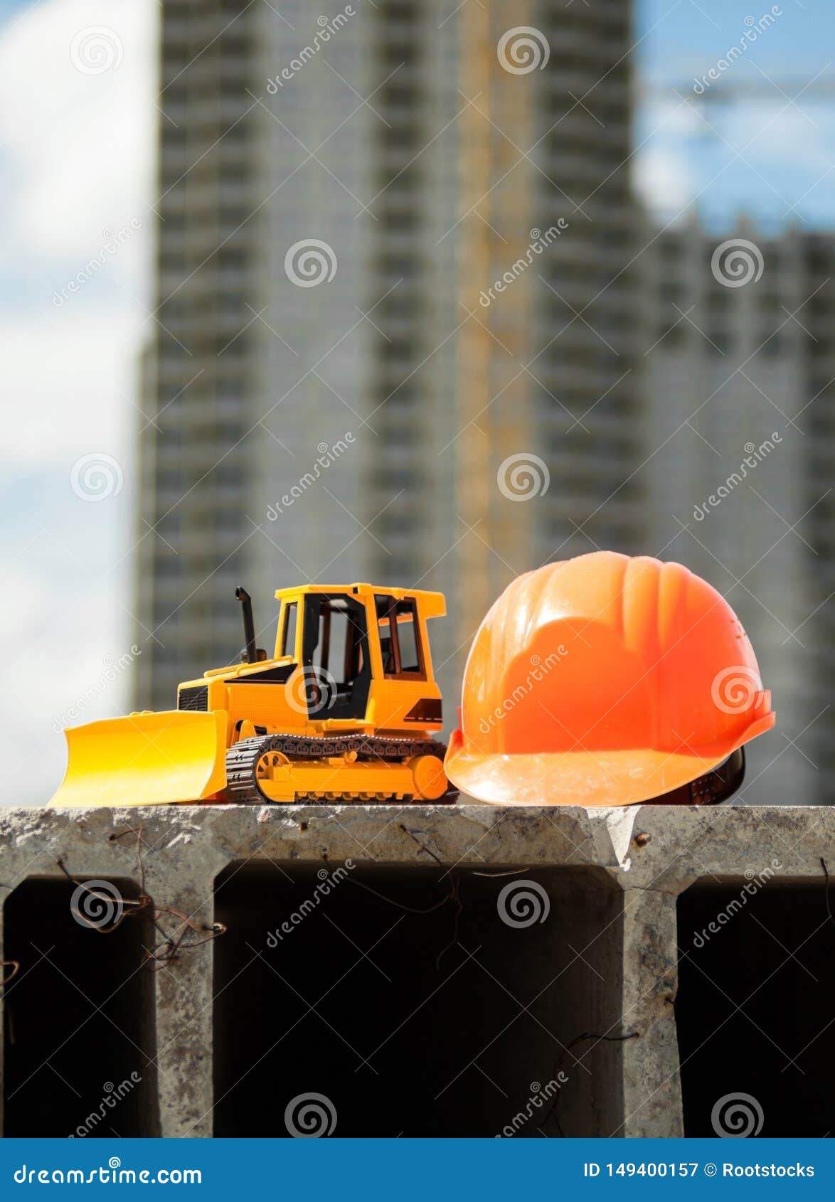 Builder`s Helmet and Toy Bulldozer in the Construction Site Stock Image ...