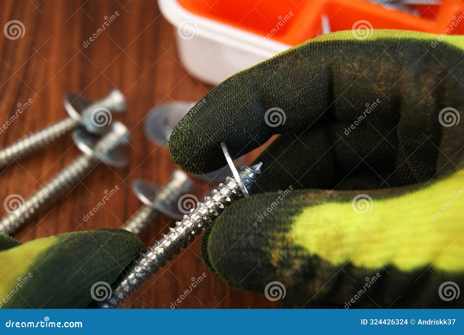 Builder S Work Process. Putting the Washer on the Screw. Stock Photo ...