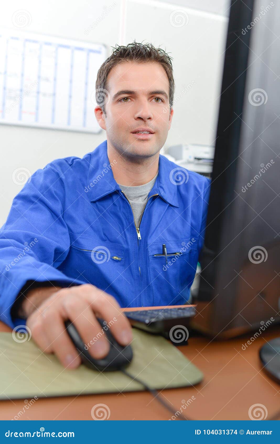 Builder sat at desk stock photo. Image of foreman, computer - 104031374