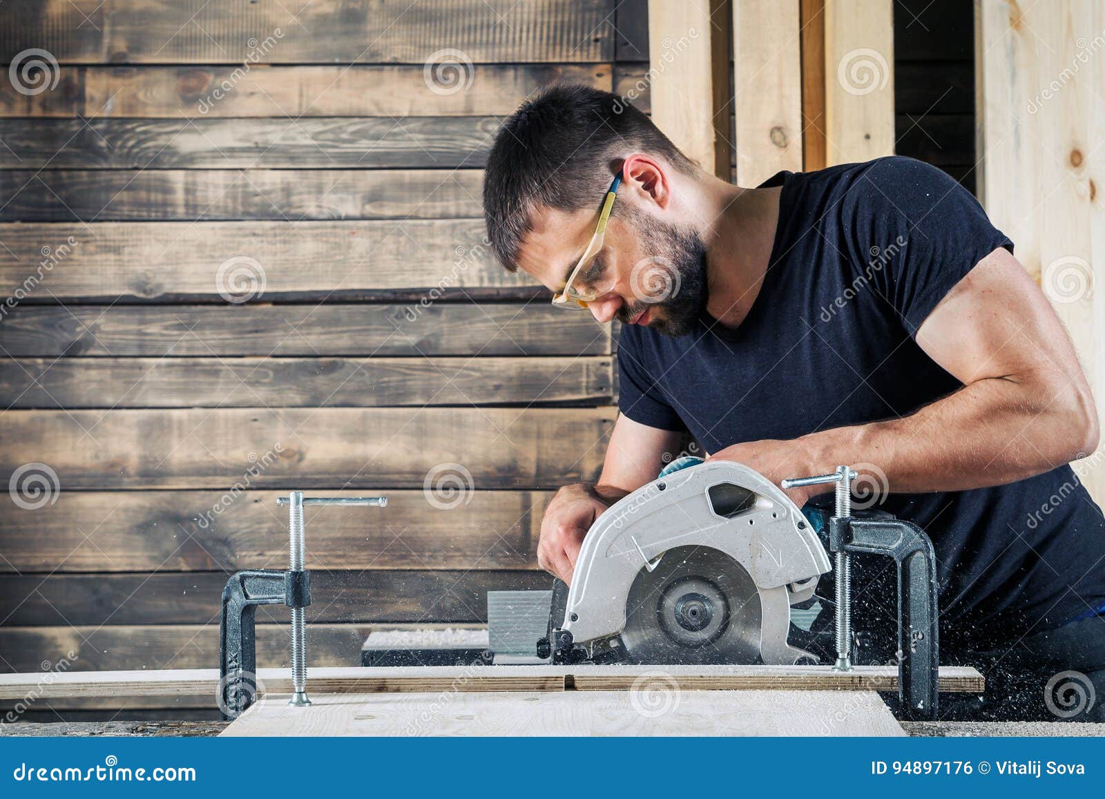 Builder saws a board stock photo. Image of miter, machine - 94897176