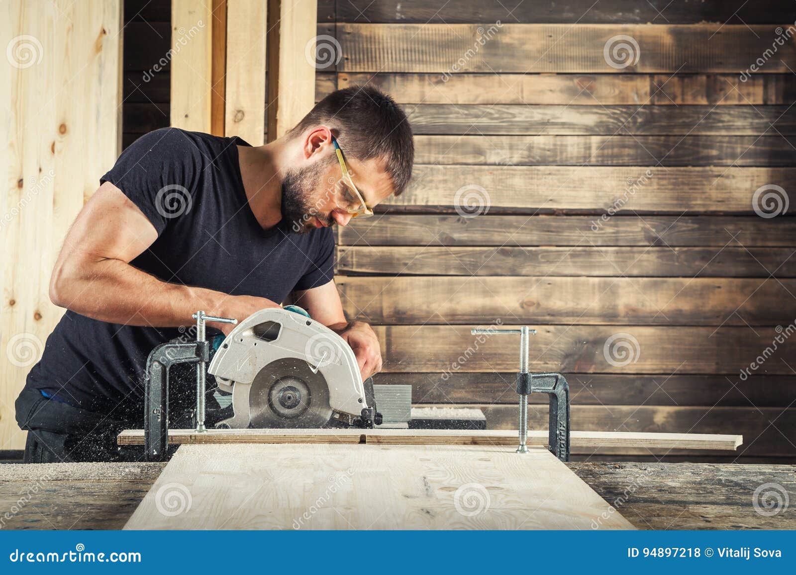 Builder saws a board stock photo. Image of industry, miter - 94897218