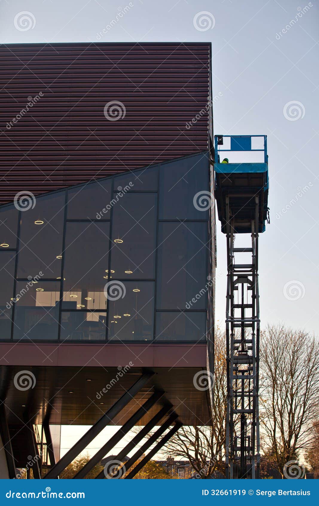 Builder on a Scissor Lift Platform at a Construction Site Stock Image ...