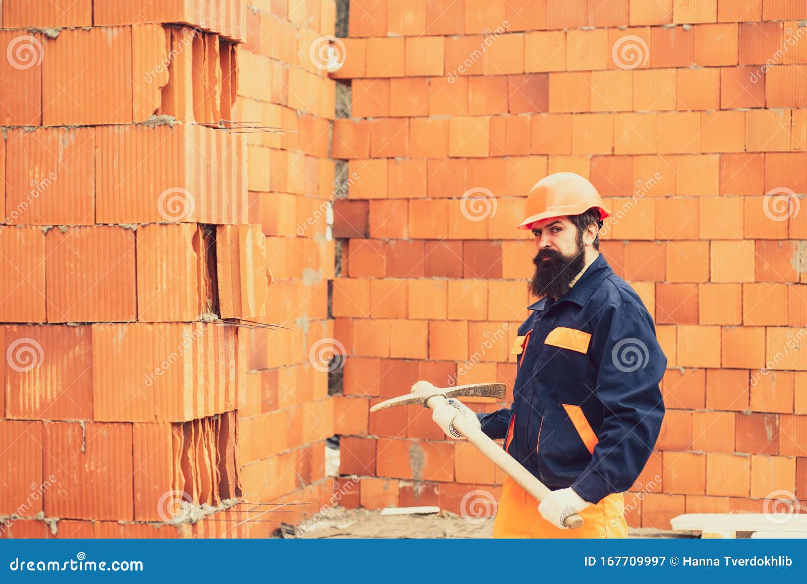 Builder. Serious Look. Brick House. Bearded Man. Handsome Man on ...