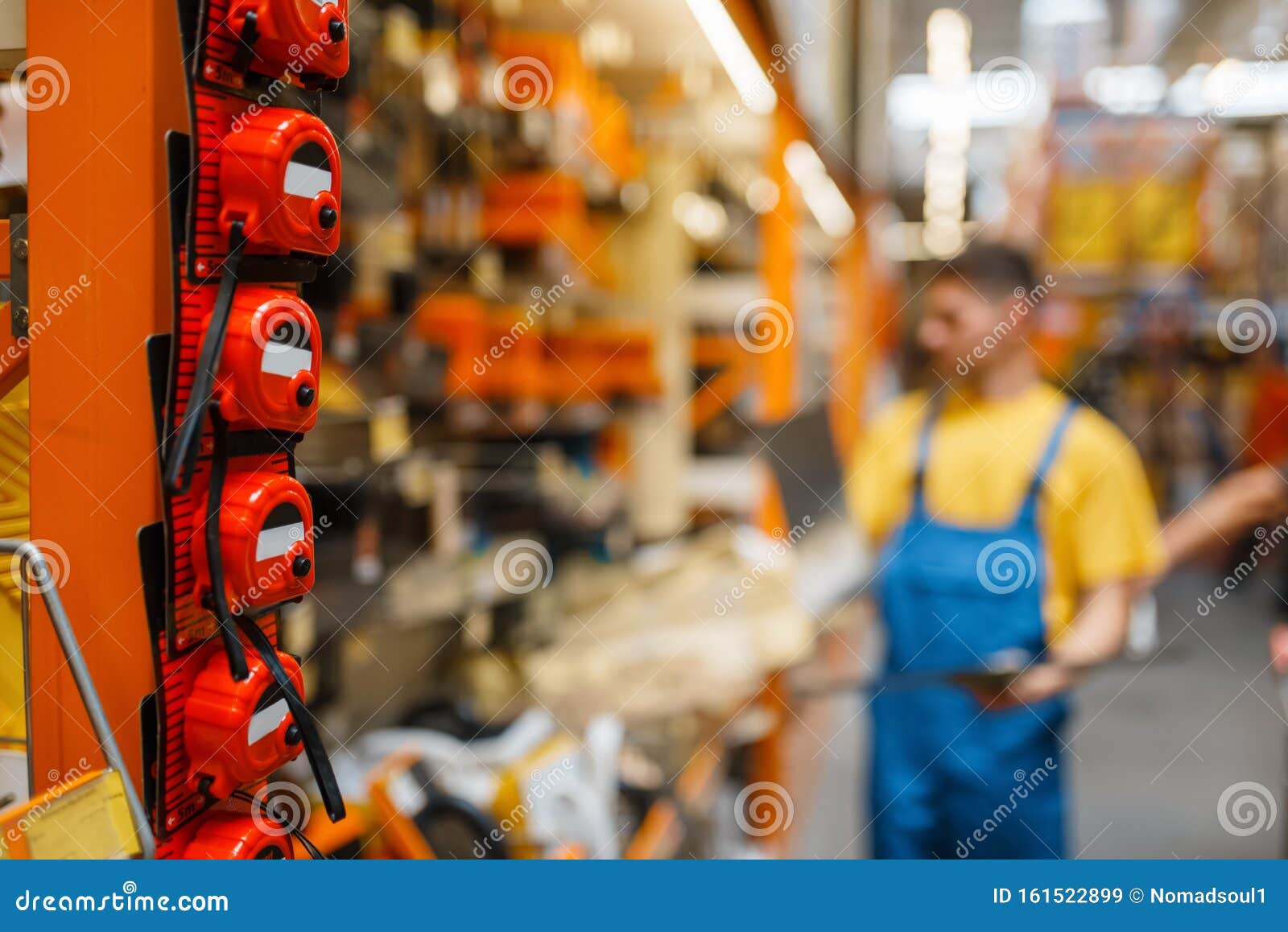 Builder at the Shelf with Tools in Hardware Store Stock Image - Image ...