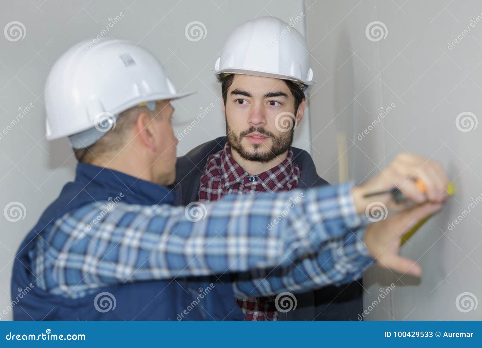 Builder Showing Apprentice How To Work on Wall Stock Image - Image of ...