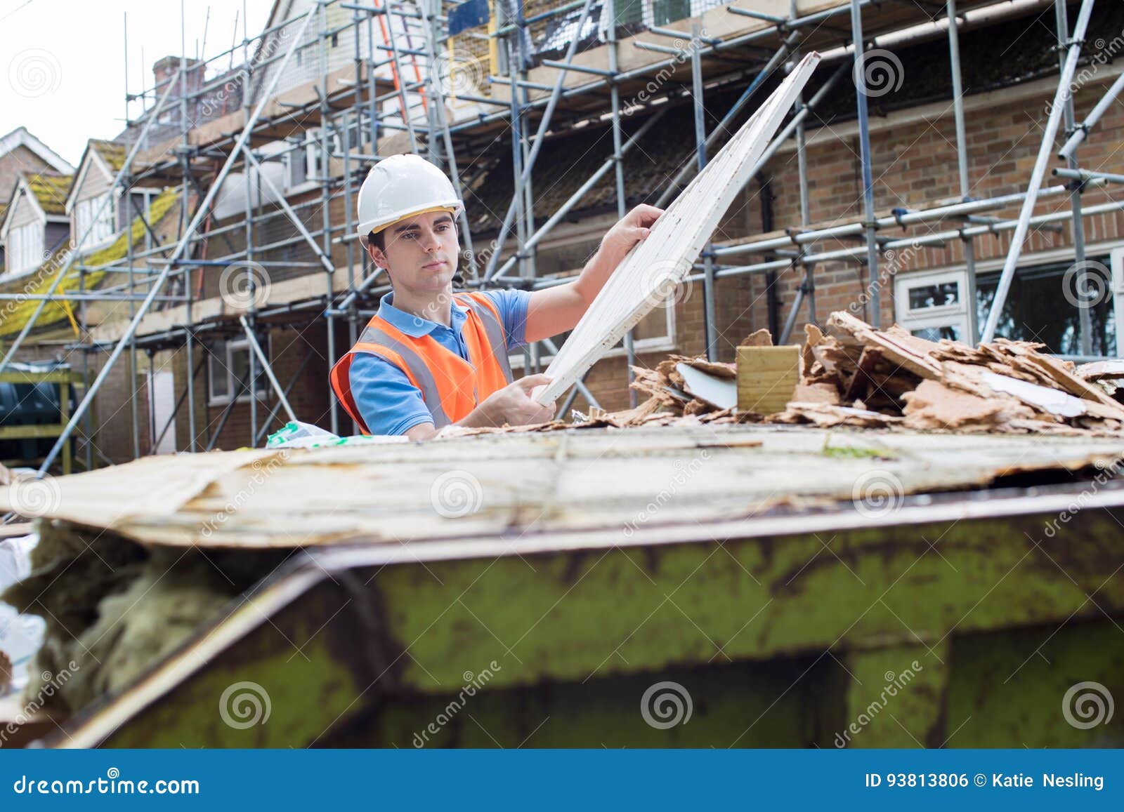 Builder on Site Putting Waste into Rubbish Skip Stock Photo - Image of ...