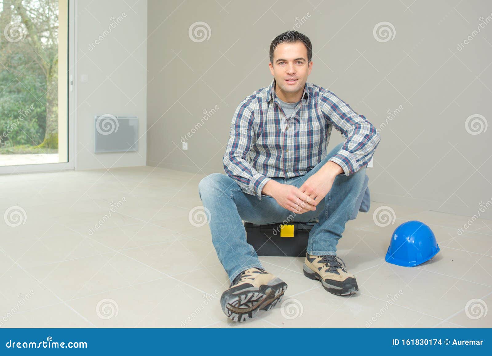 Builder Sitting and Relaxing Next To Hardhat Stock Photo - Image of ...
