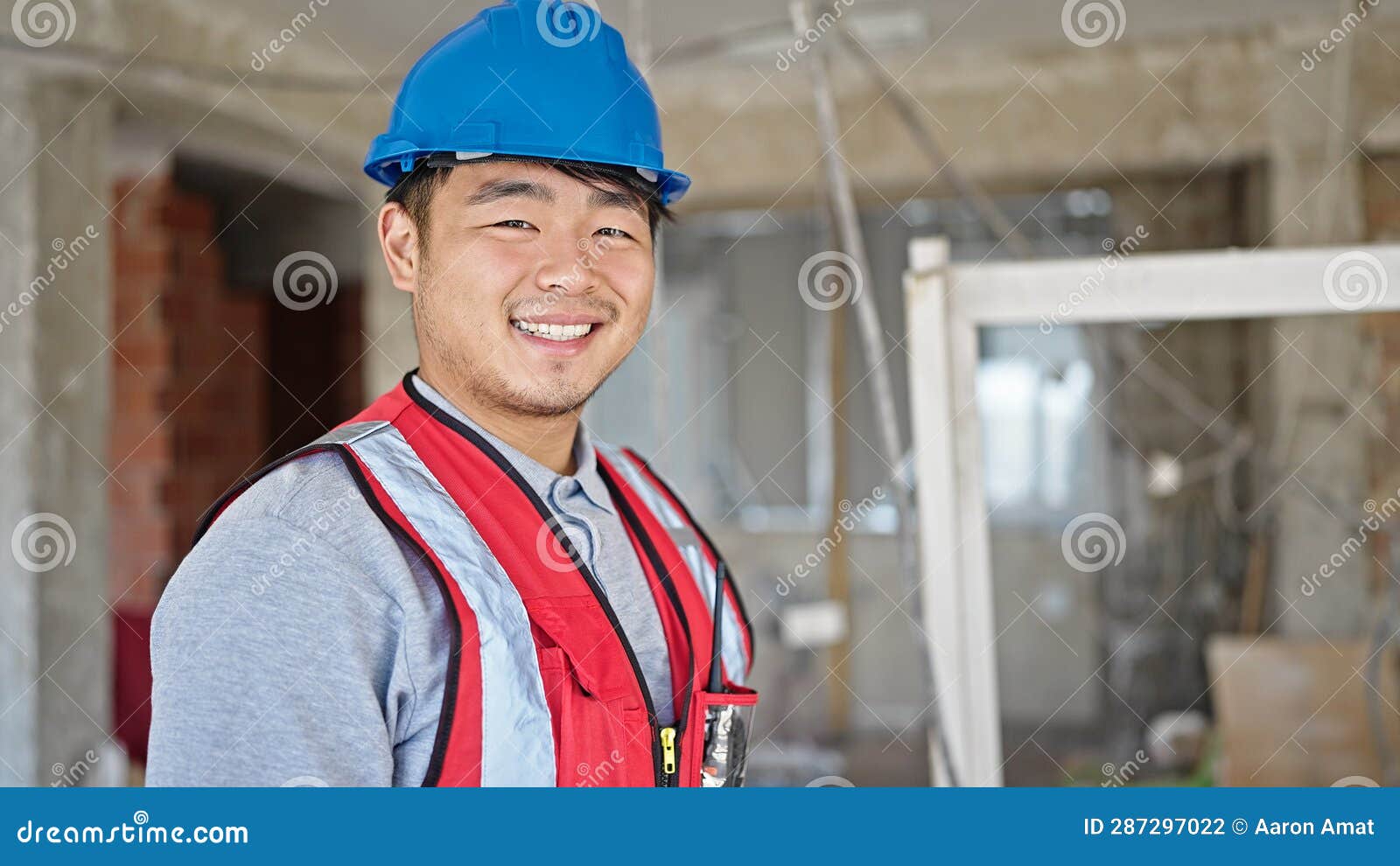Builder Smiling Confident Standing at Construction Site Stock Photo ...