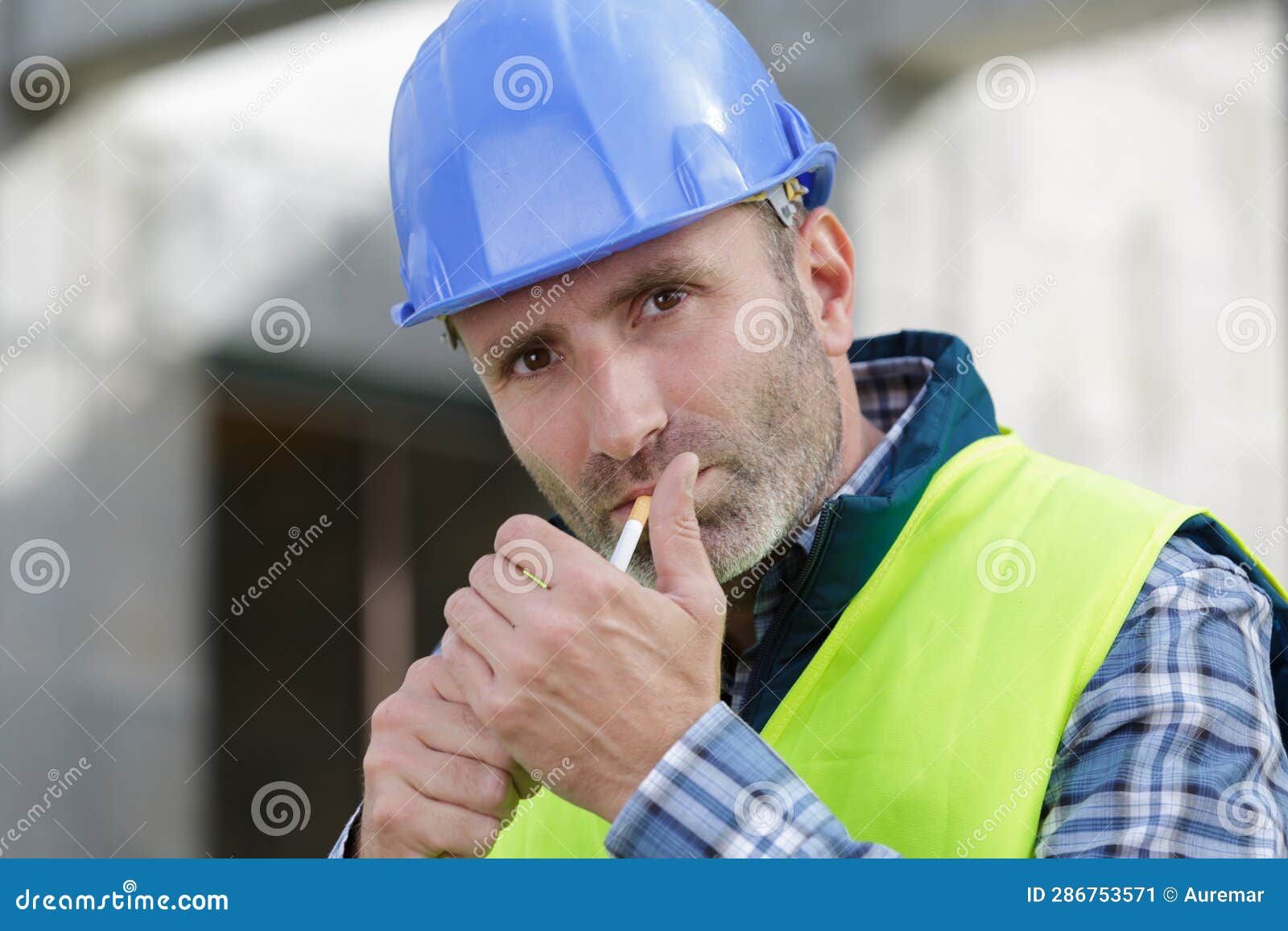 Builder smoking cigarette stock image. Image of strength - 286753571