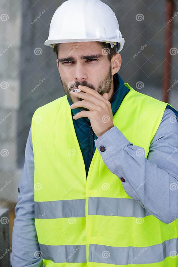 Builder Smoking Cigarette at Construction Site Stock Photo - Image of ...