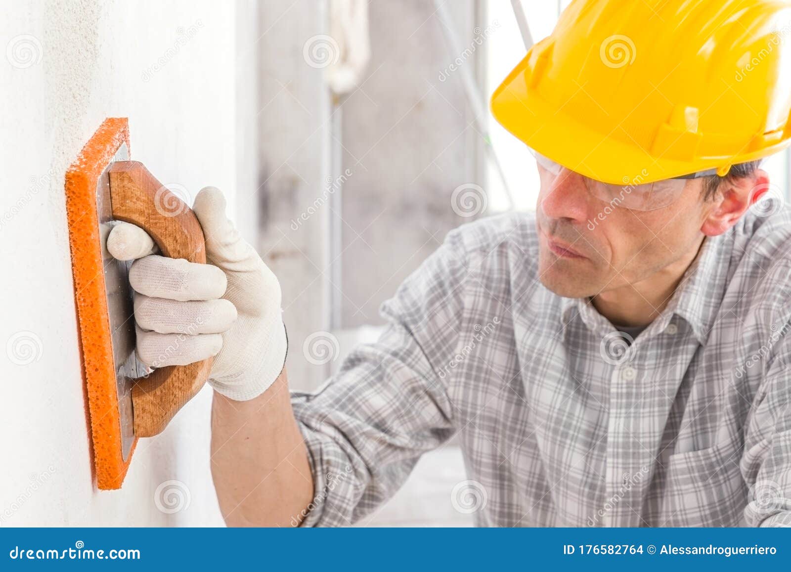 Builder Smoothing New Plaster on an Interior Wall Stock Photo - Image ...