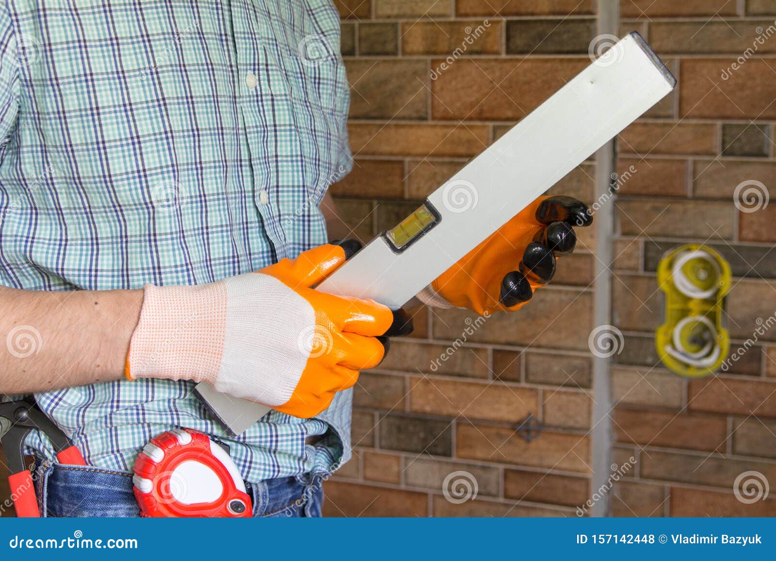Builder with Spirit Level,man Builder with Tools in Hands Stock Photo ...
