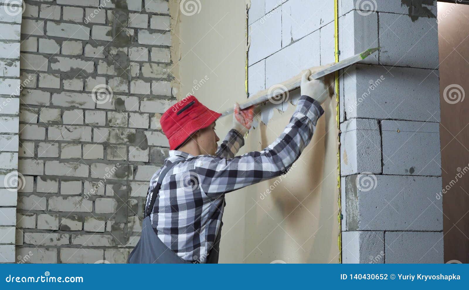 Builder Spreading Plaster on Aerated Concrete Block Wall with ...
