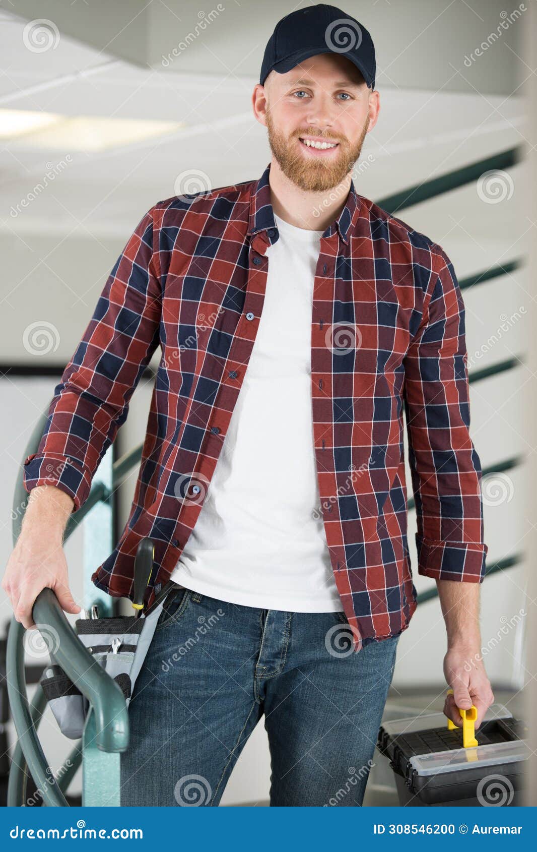 Builder Standing on Staircase Smiling at Camera Stock Photo - Image of ...
