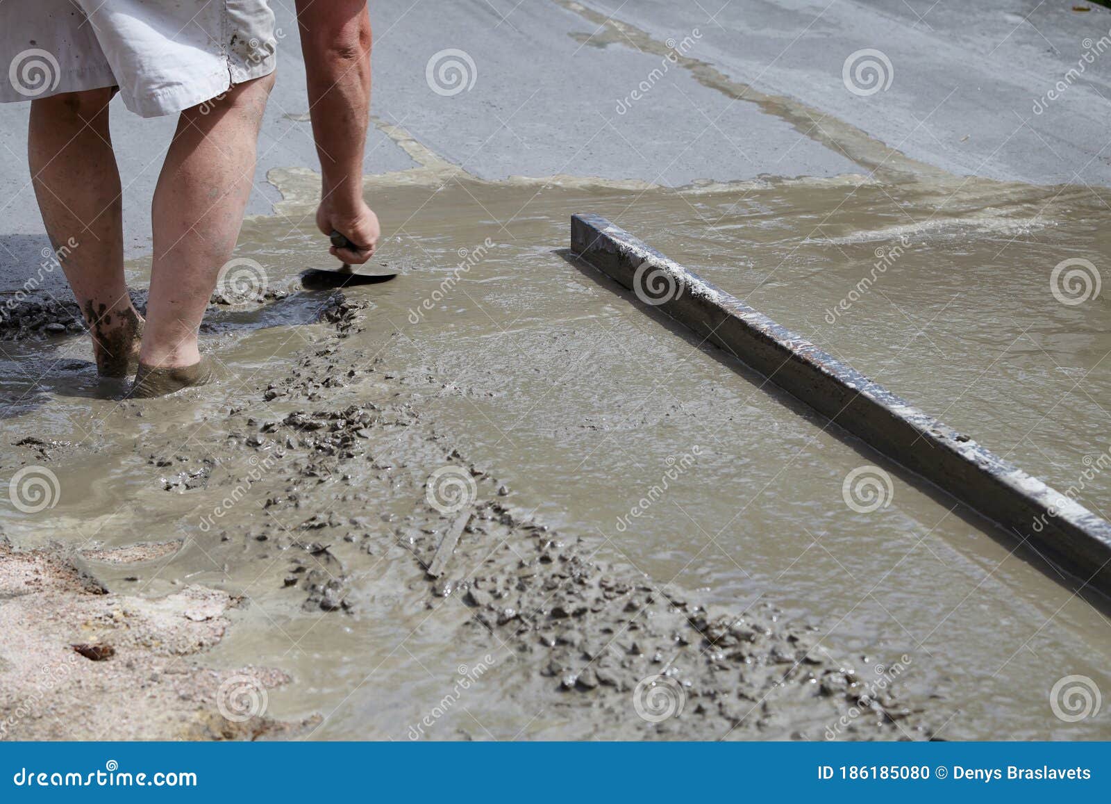 The Builder Stands with His Feet in Cement, Concrete Floors. Cheap ...
