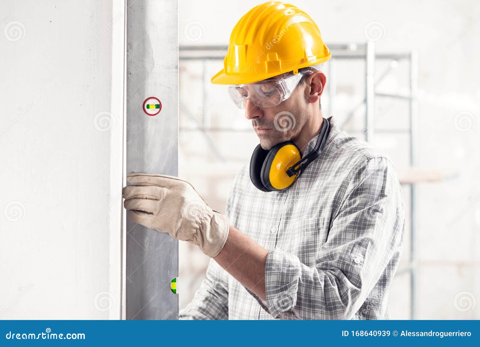 Builder or Contractor Using a Large Spirit Level Stock Image - Image of ...