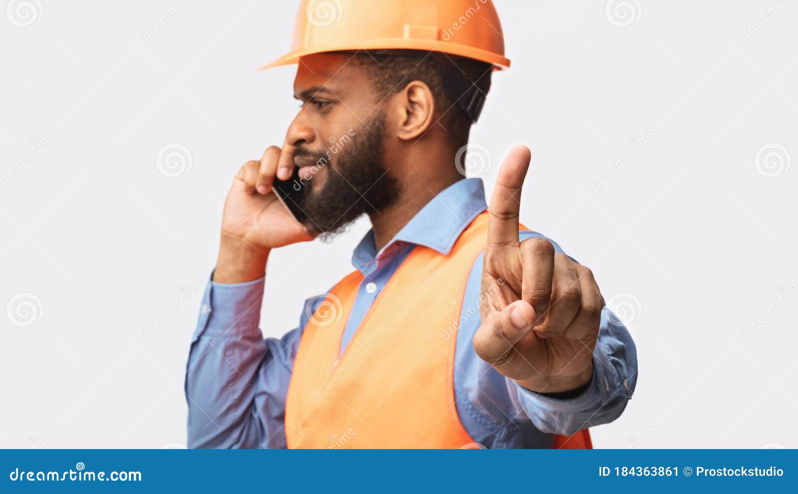 Builder Talking on Phone Gesturing Wait a Minute, White Background ...