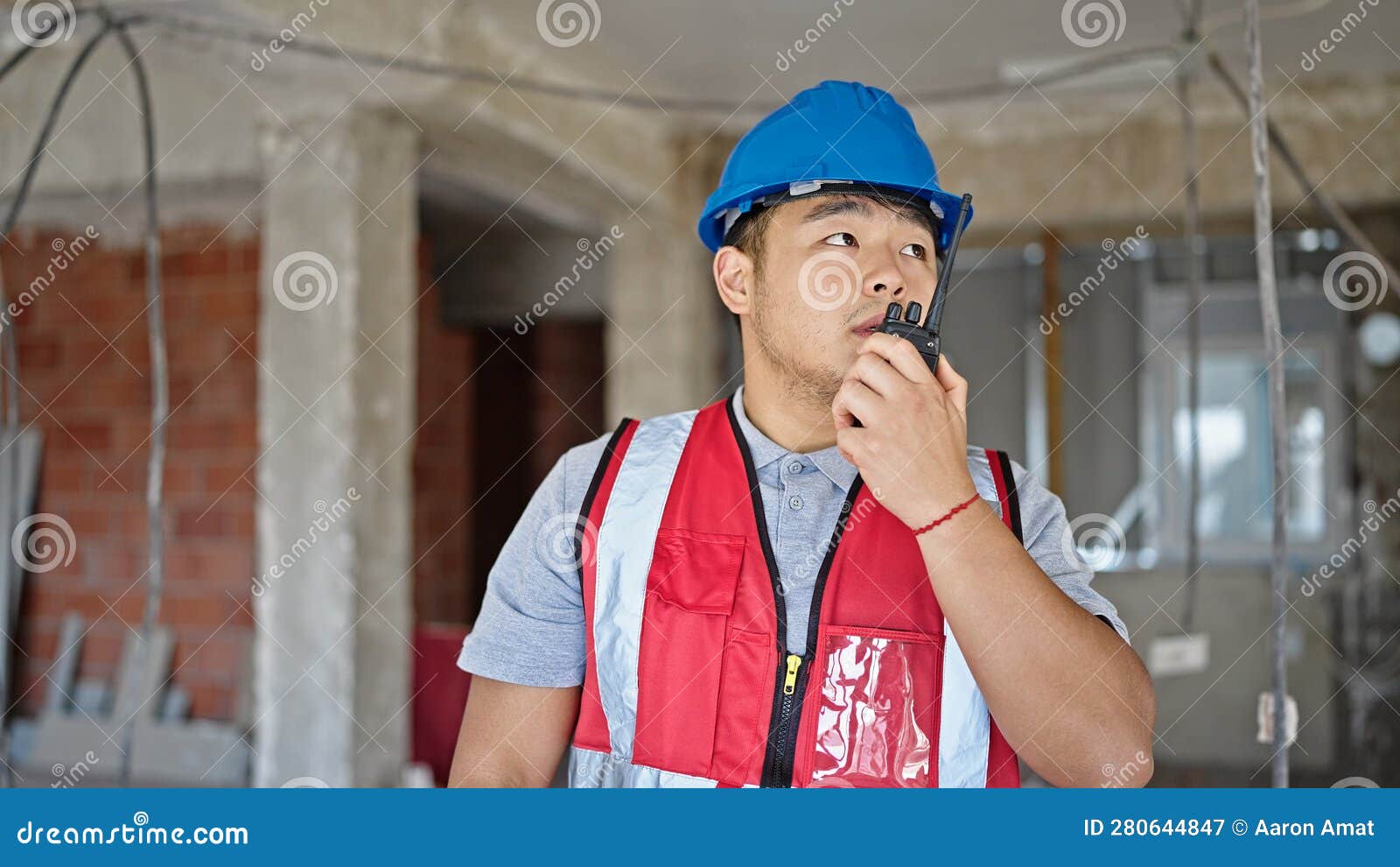 Builder Talking on Walkie Talkie at Construction Site Stock Image ...