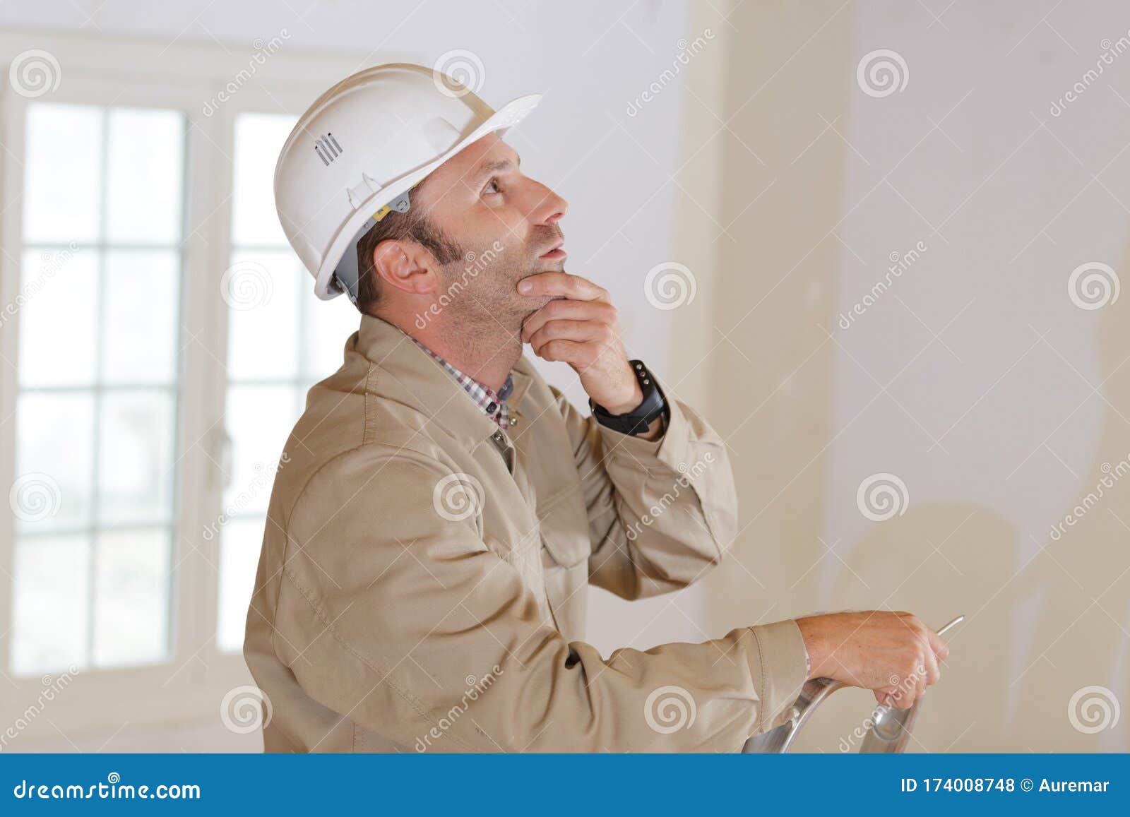 Builder Thinking about Something while Holding Clipboard Stock Photo ...